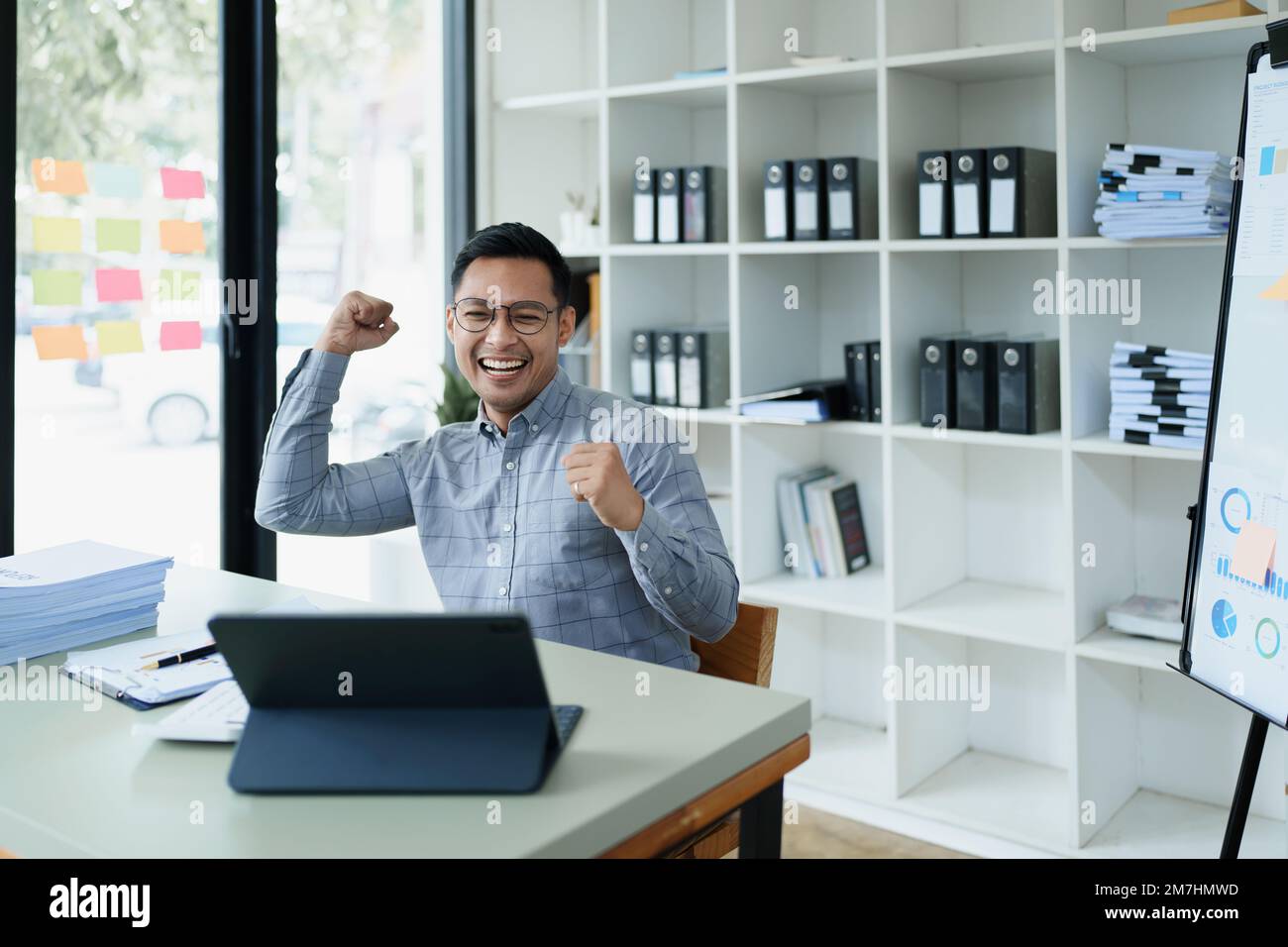 Portrait of a man business owner showing a happy smiling face as he has ...