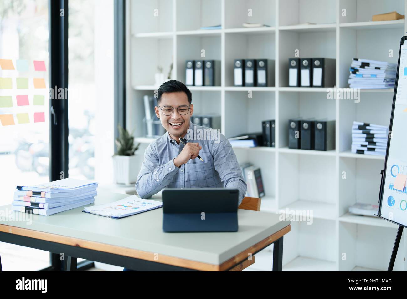 Portrait of a man business owner showing a happy smiling face as he has ...