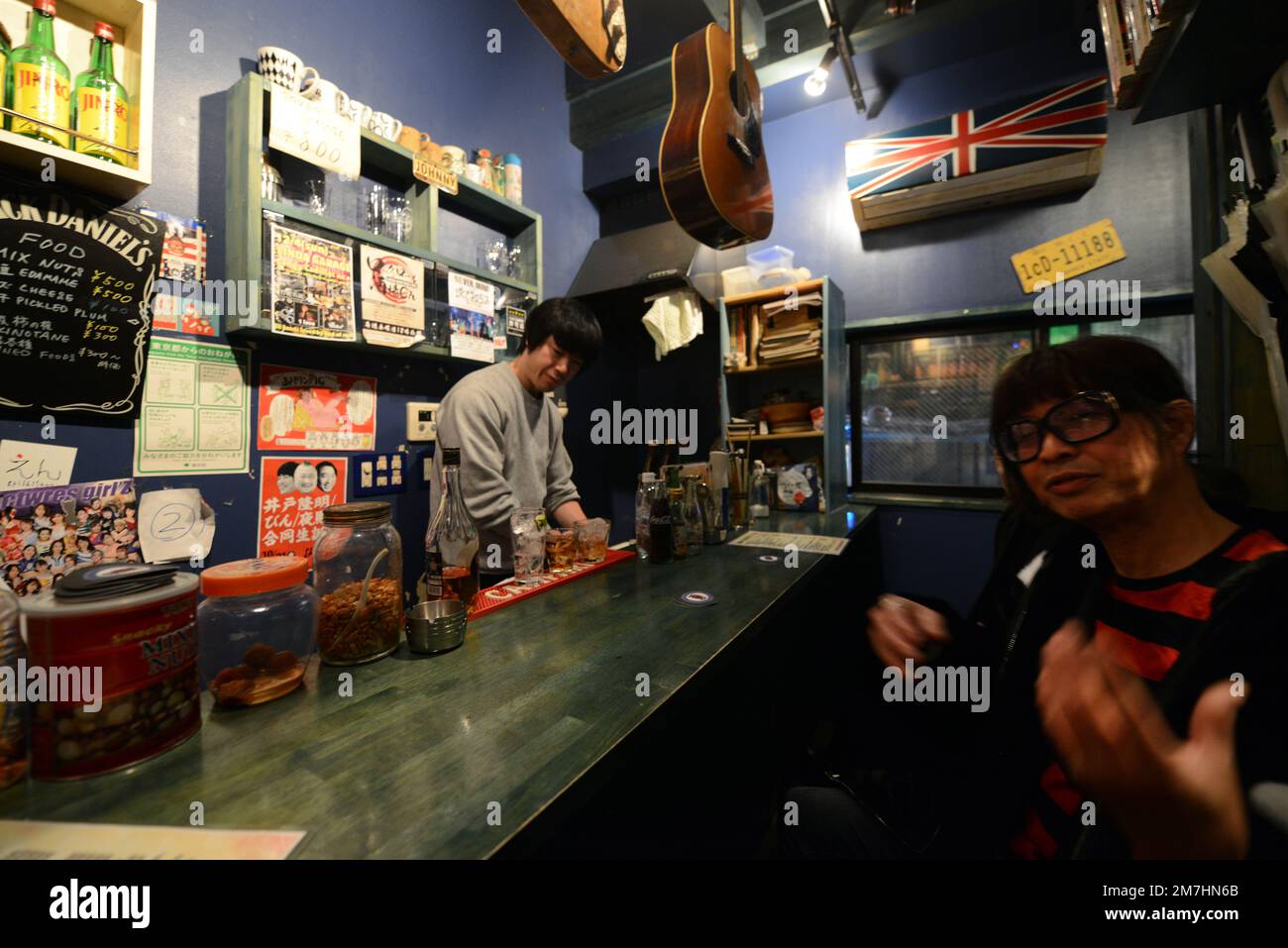 Drinking in a small atmospheric pub in the Golden Gai pub area in ...