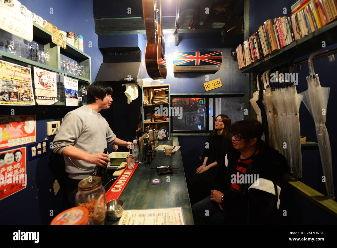 Drinking in a small atmospheric pub in the Golden Gai pub area in ...