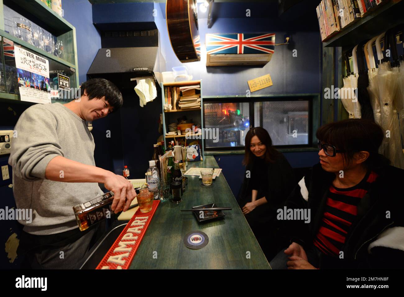 Drinking in a small atmospheric pub in the Golden Gai pub area in ...