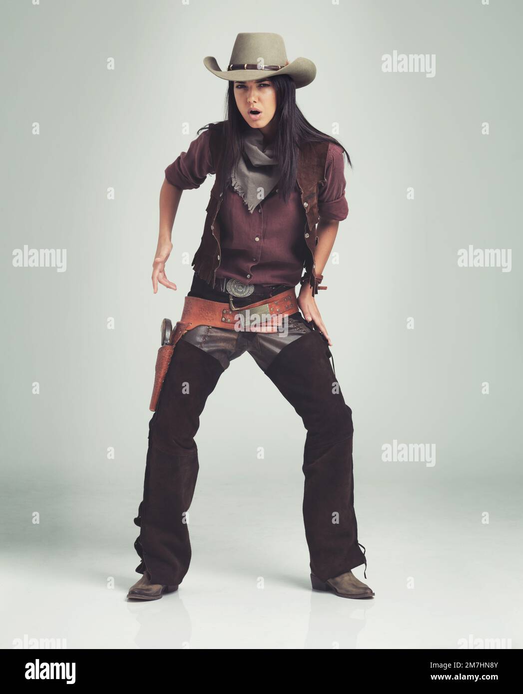 Im the sheriff around these parts...Full-length shot of an attractive ...