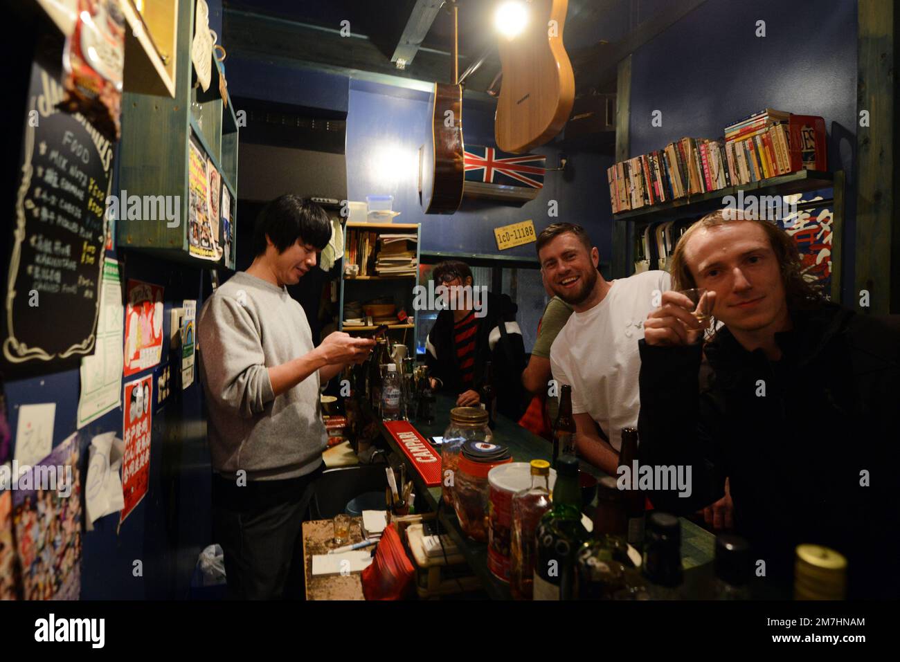 Drinking in a small atmospheric pub in the Golden Gai pub area in ...