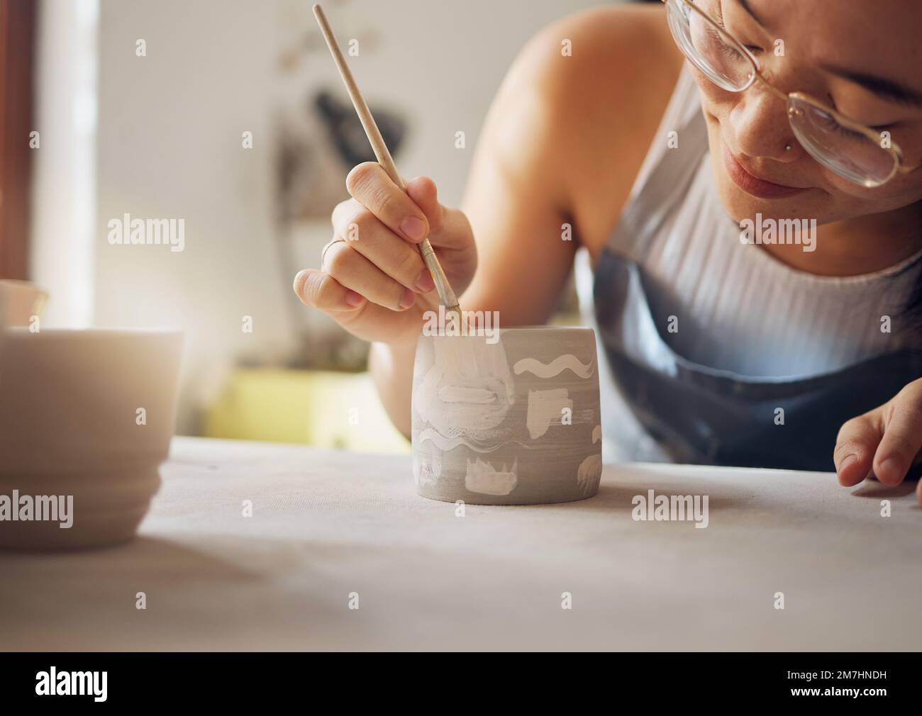 Woman, pottery studio and painting workshop for sculpture product ...