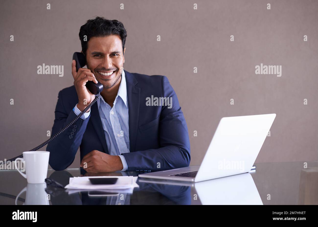 Hes working hard to complete his tasks. a handsome young businessman ...
