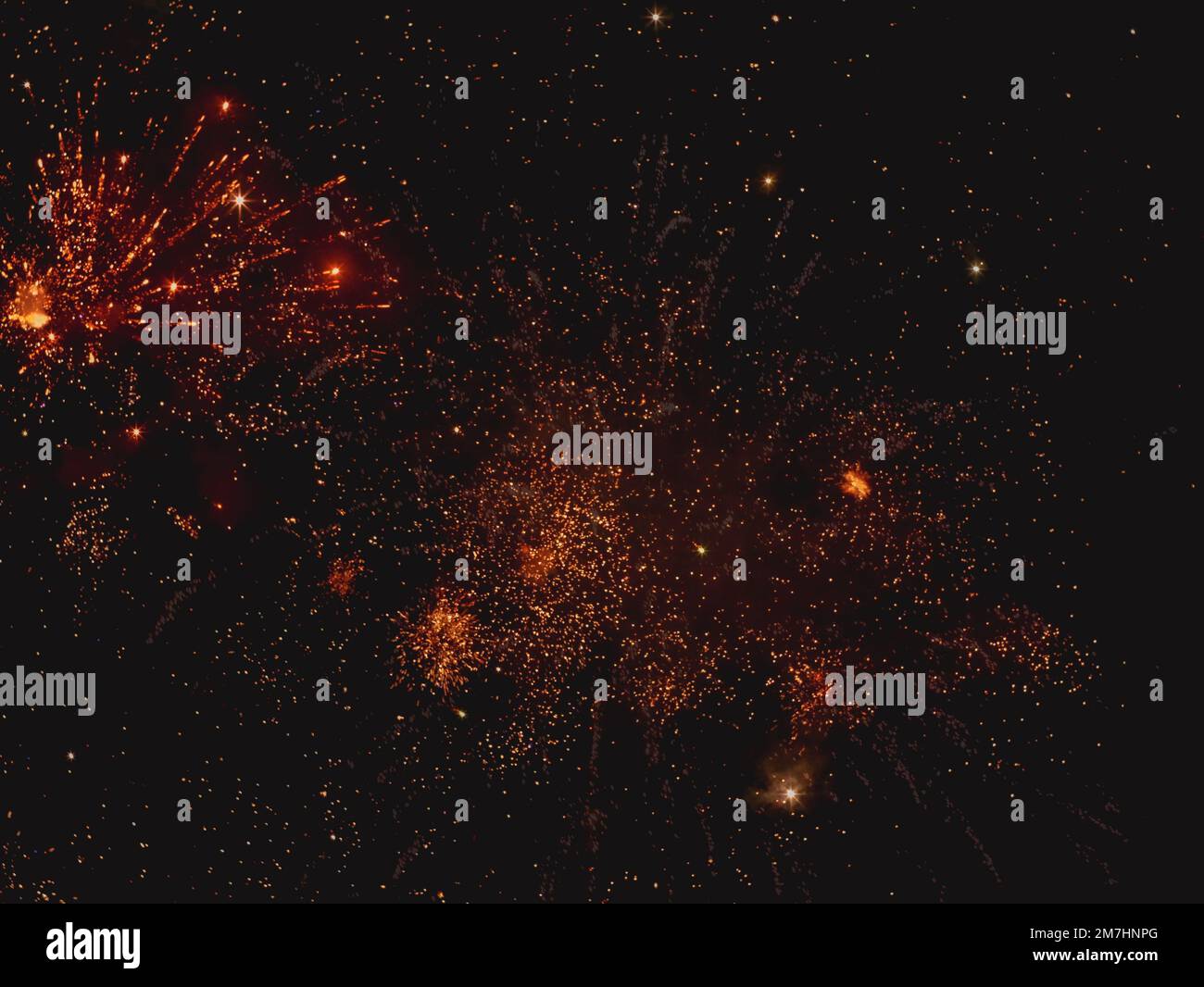 The orange fireworks on a dark night sky perfect for backgrounds and ...