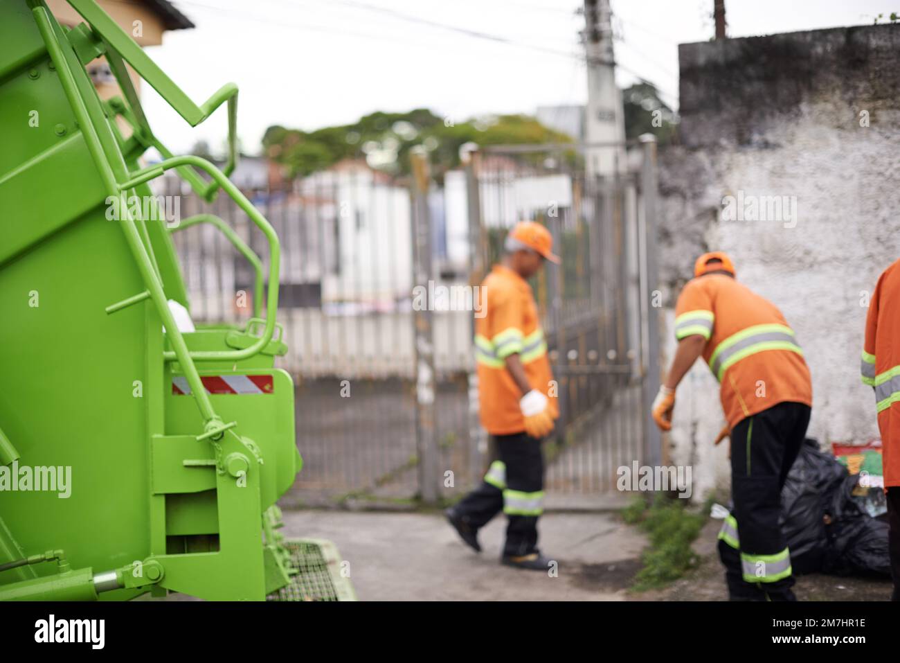 Garbage collection day. a garbage collection team at work Stock Photo ...