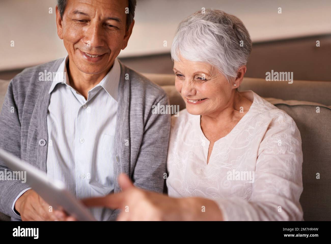 Getting to know the world of technology. A senior couple using a ...