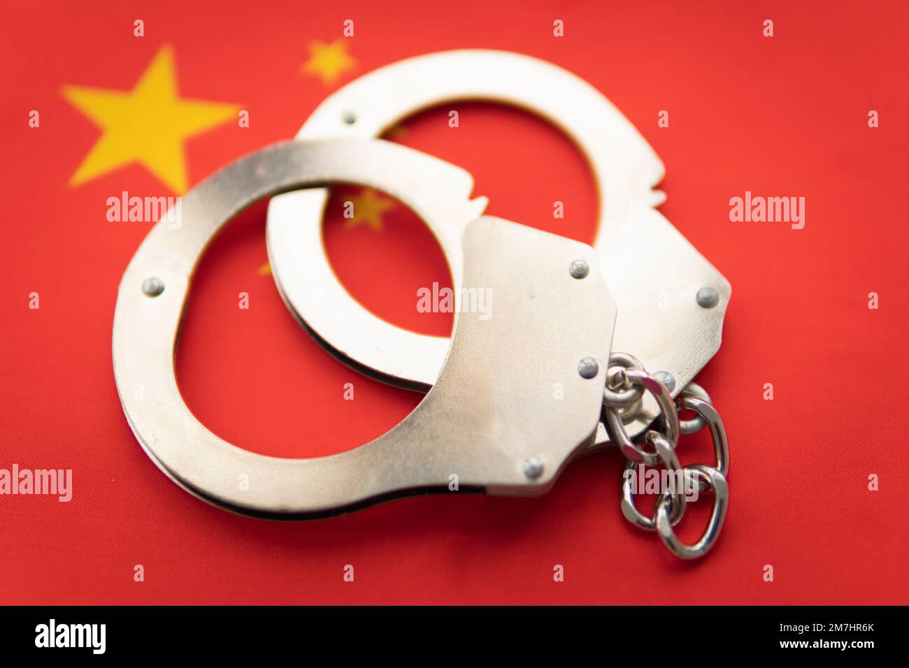 Chinese handcuffs hi-res stock photography and images - Alamy