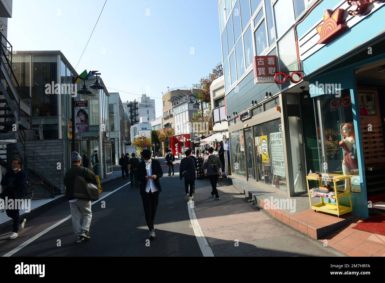 Walking through the backstreets of Ura-Harajuku, a trendy area with ...