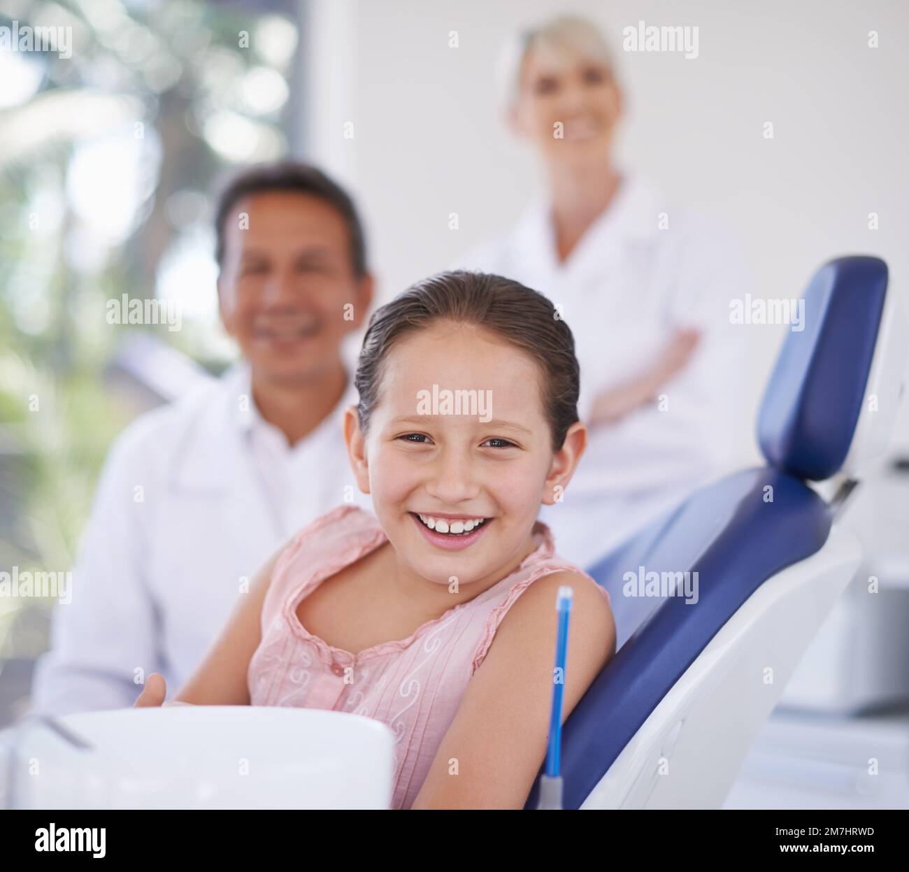 A day at the dentist is an adventure to her. Portrait of a dentist and ...