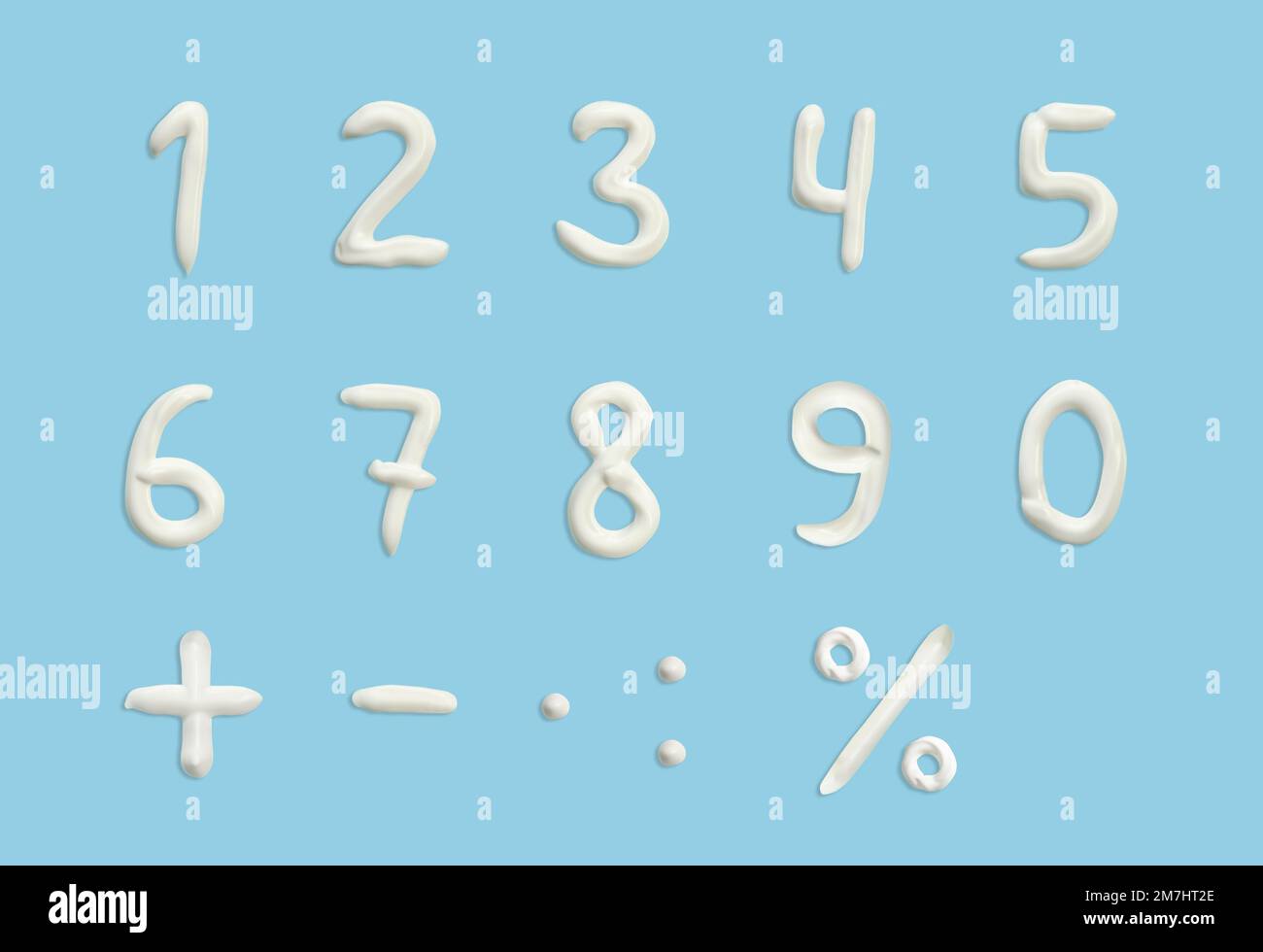 numbers of the English alphabet in the form of squeezed cream in white ...
