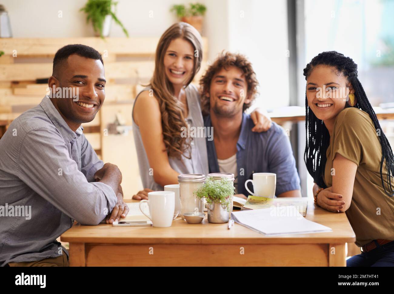 Catching up with old friends. a group of friends talking in a cafe ...