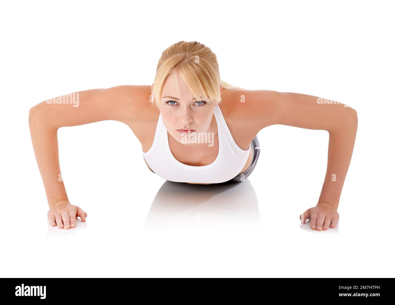 Toning through body weight exercises. Portrait of a determined young ...