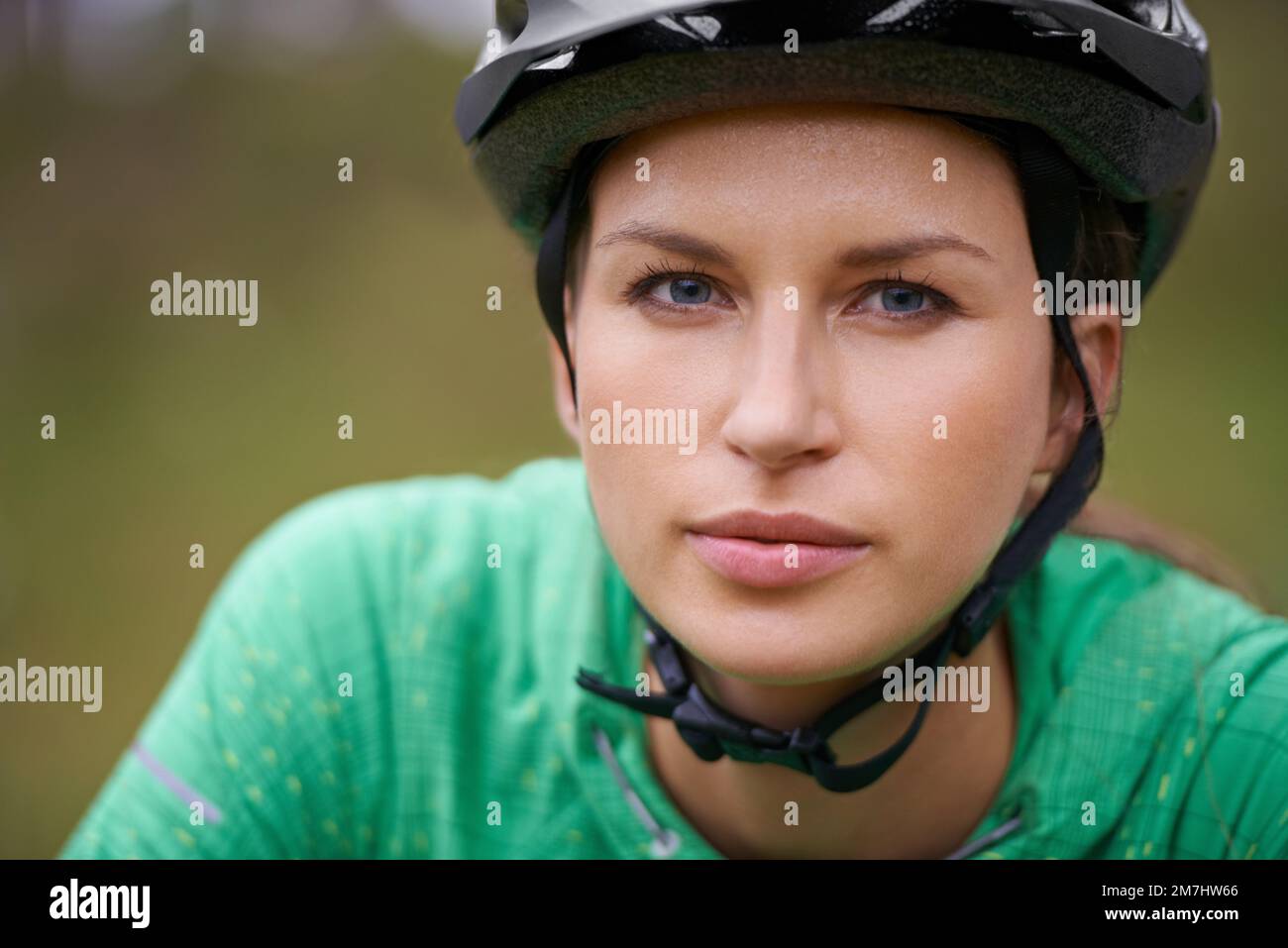 Cycling is her life. an attractive young woman cycling outdoors Stock ...