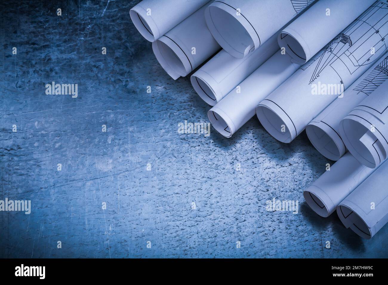 Architectural rolled up construction drawings on scratched vintage ...