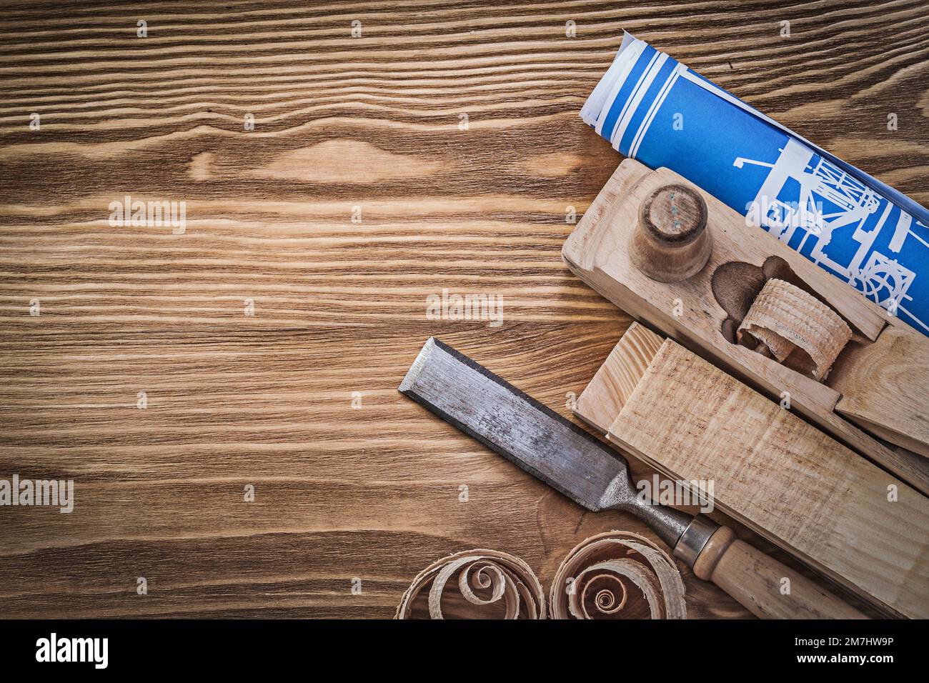Blue blueprint planer flat chisel wooden studs shavings on vintage wood ...