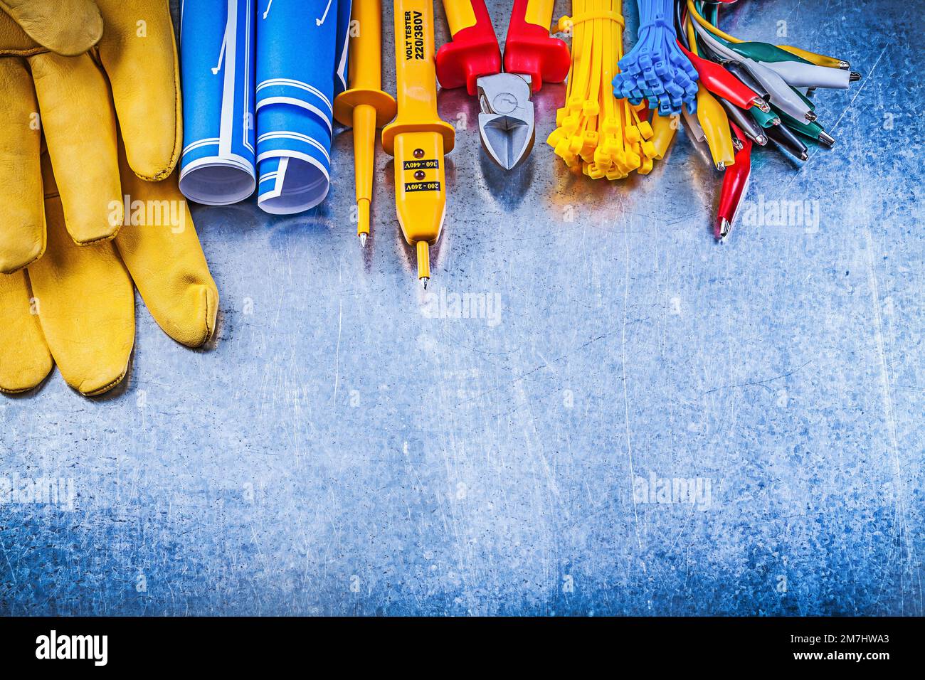 Assortment of electrical articles on metallic background electricity ...