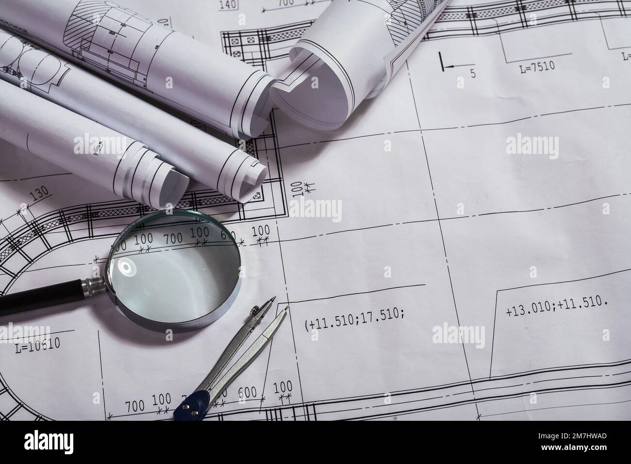 architectural blueprints and magnifer and compass Stock Photo - Alamy