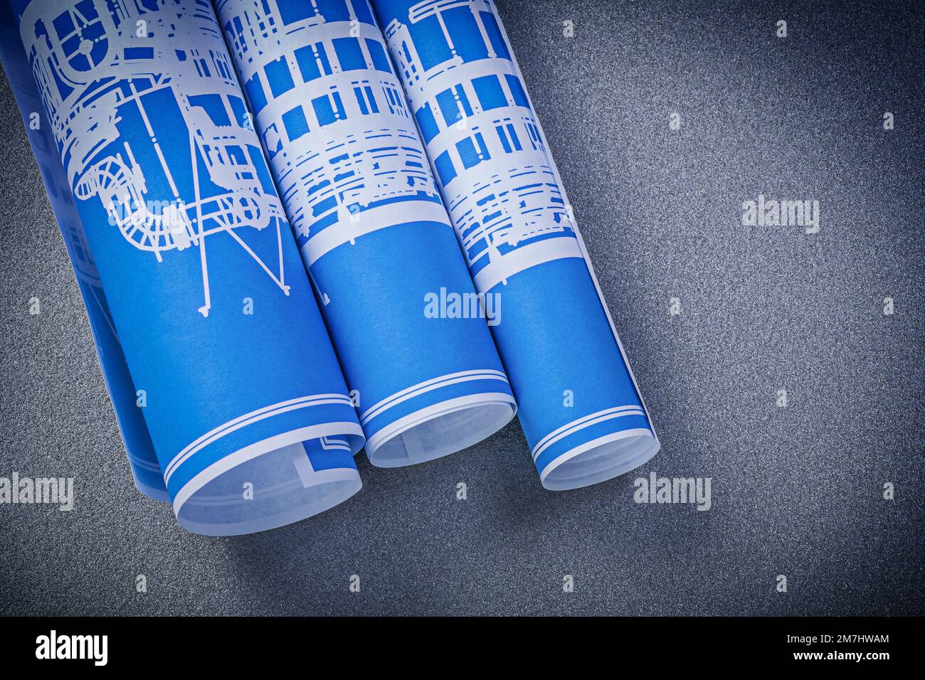 Blue blueprint rolls on grey surface construction concept Stock Photo ...