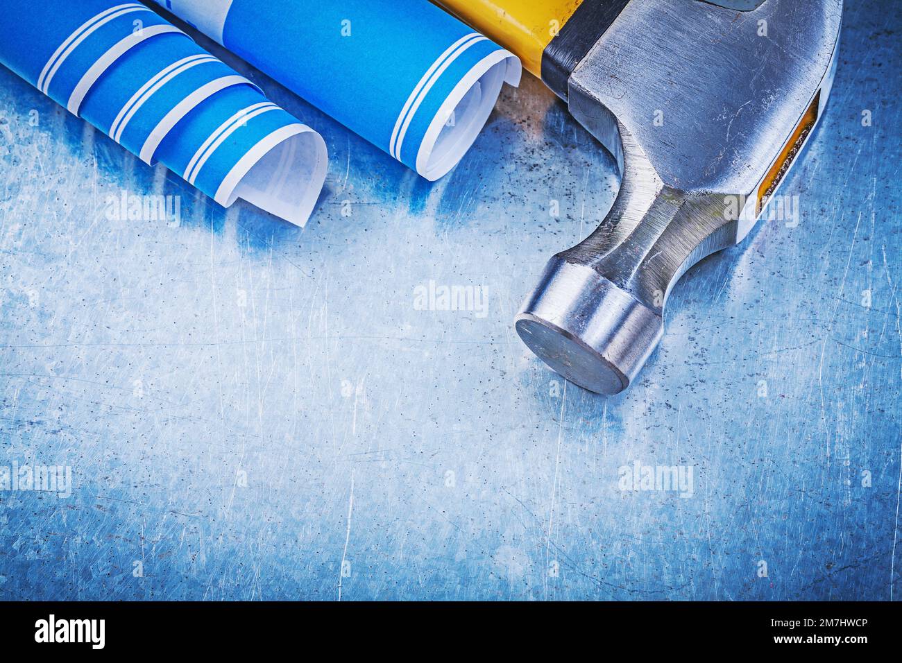 Blue blueprints claw hammer on metallic background Stock Photo - Alamy
