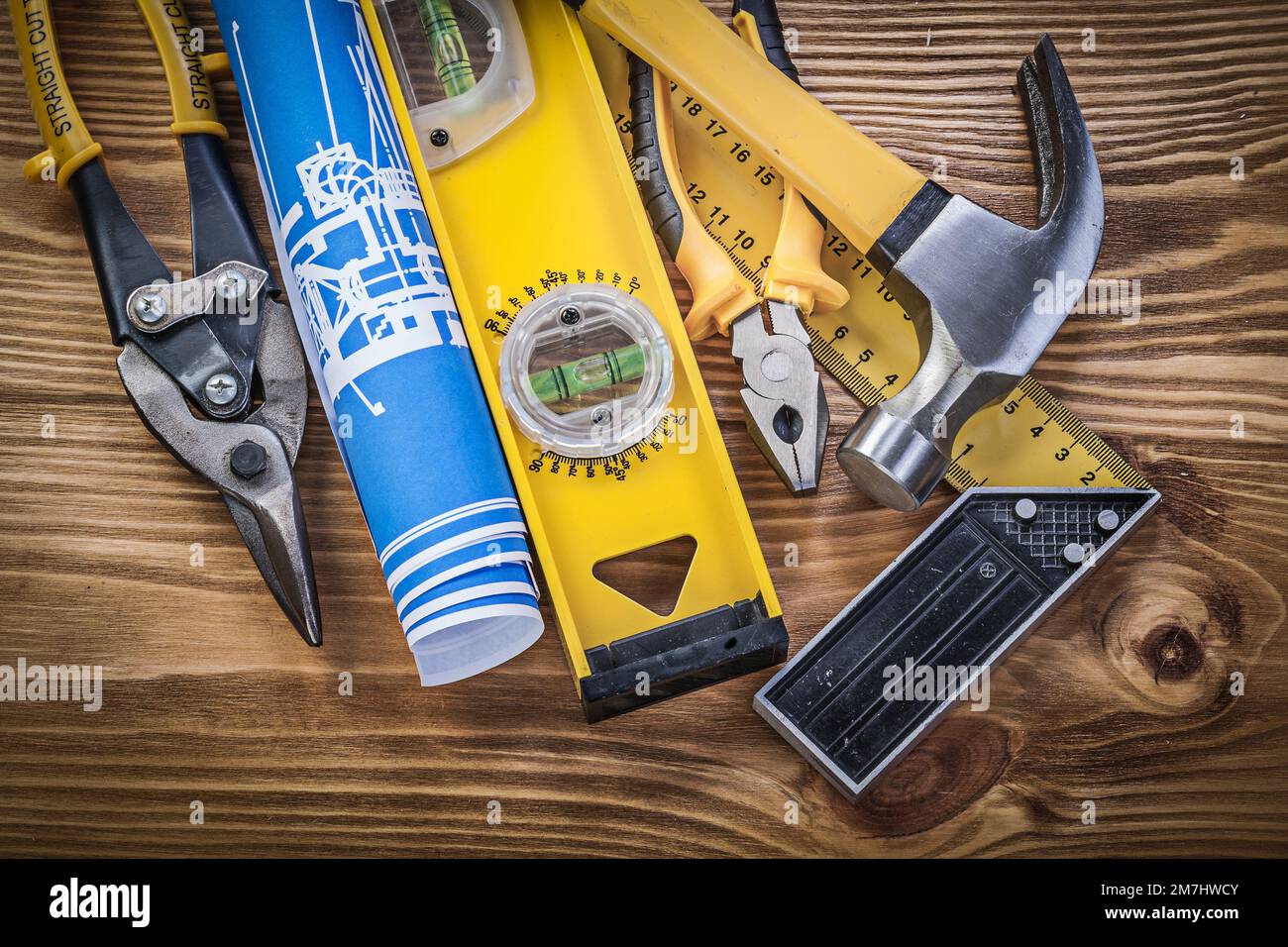 Blue blueprints construction level try square claw hammer pliers steel ...