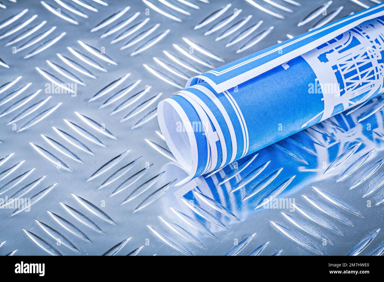 Blue blueprints on corrugated metal plate construction concept Stock ...