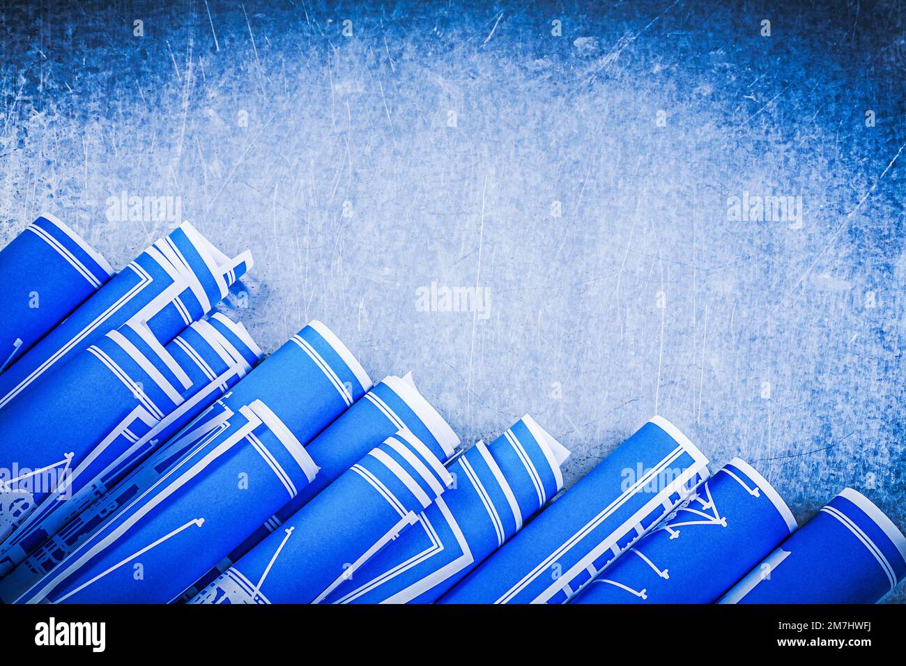 Blue construction drawings on metallic background top view maintenance ...