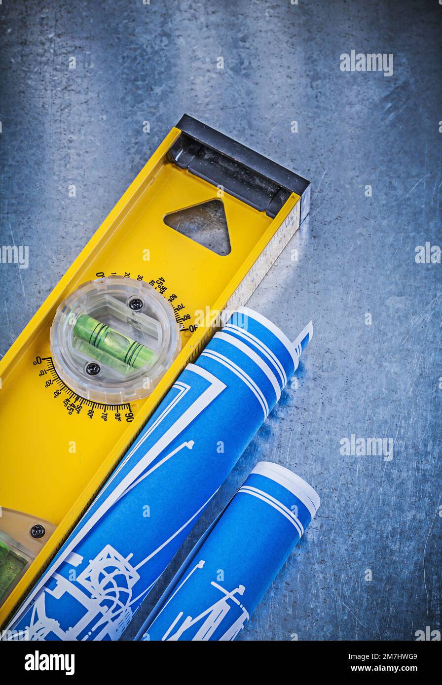 Blue construction plans level on metallic background maintenance ...