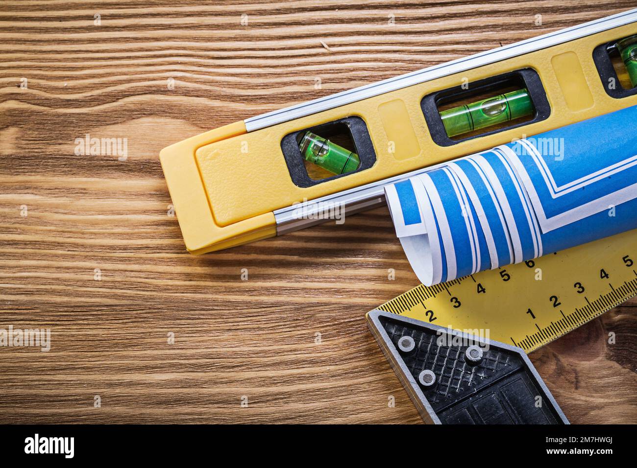 Blue engineering drawing square ruler construction level on wooden ...