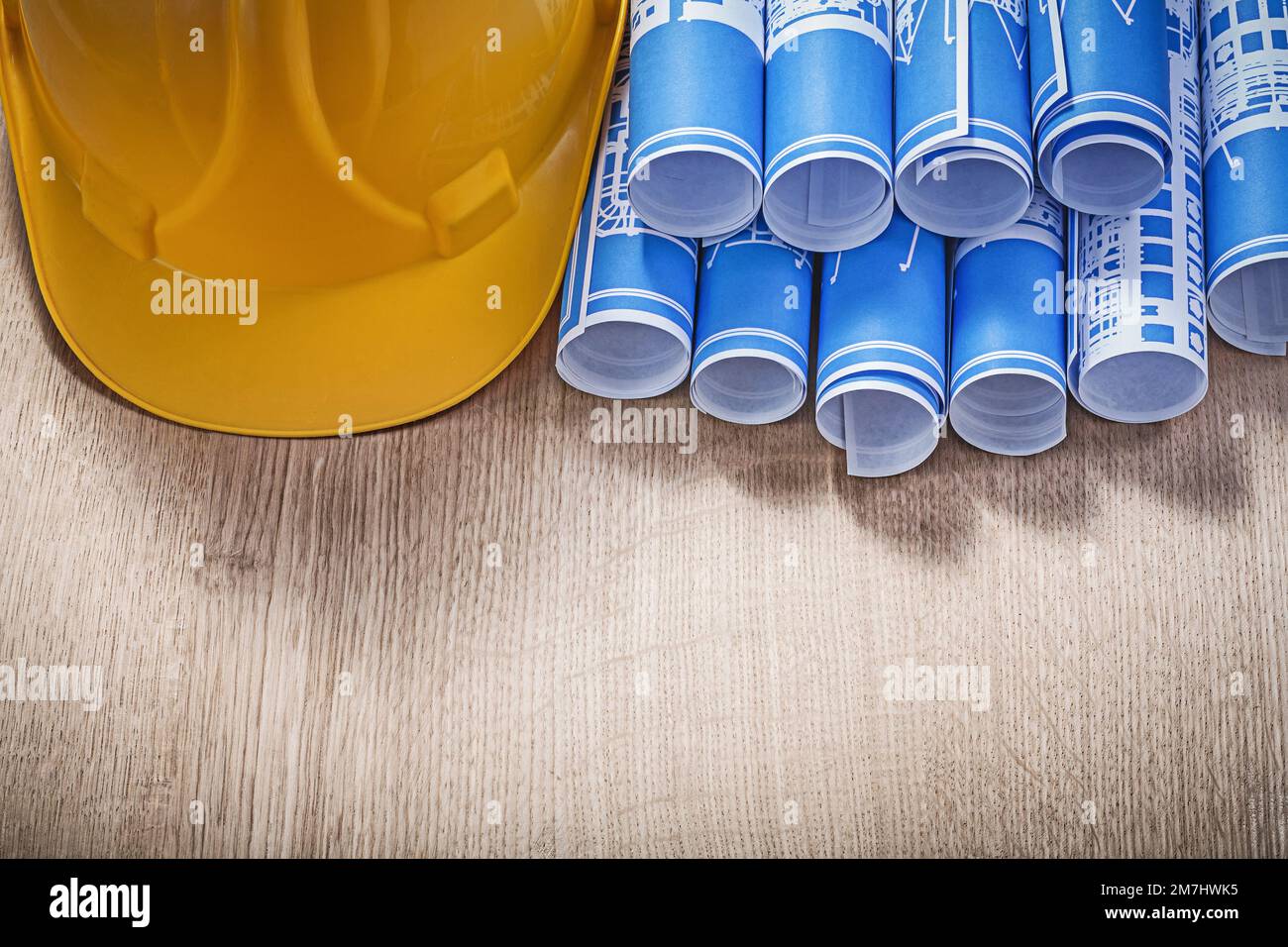 Blue engineering drawings building helmet on wooden board Stock Photo ...