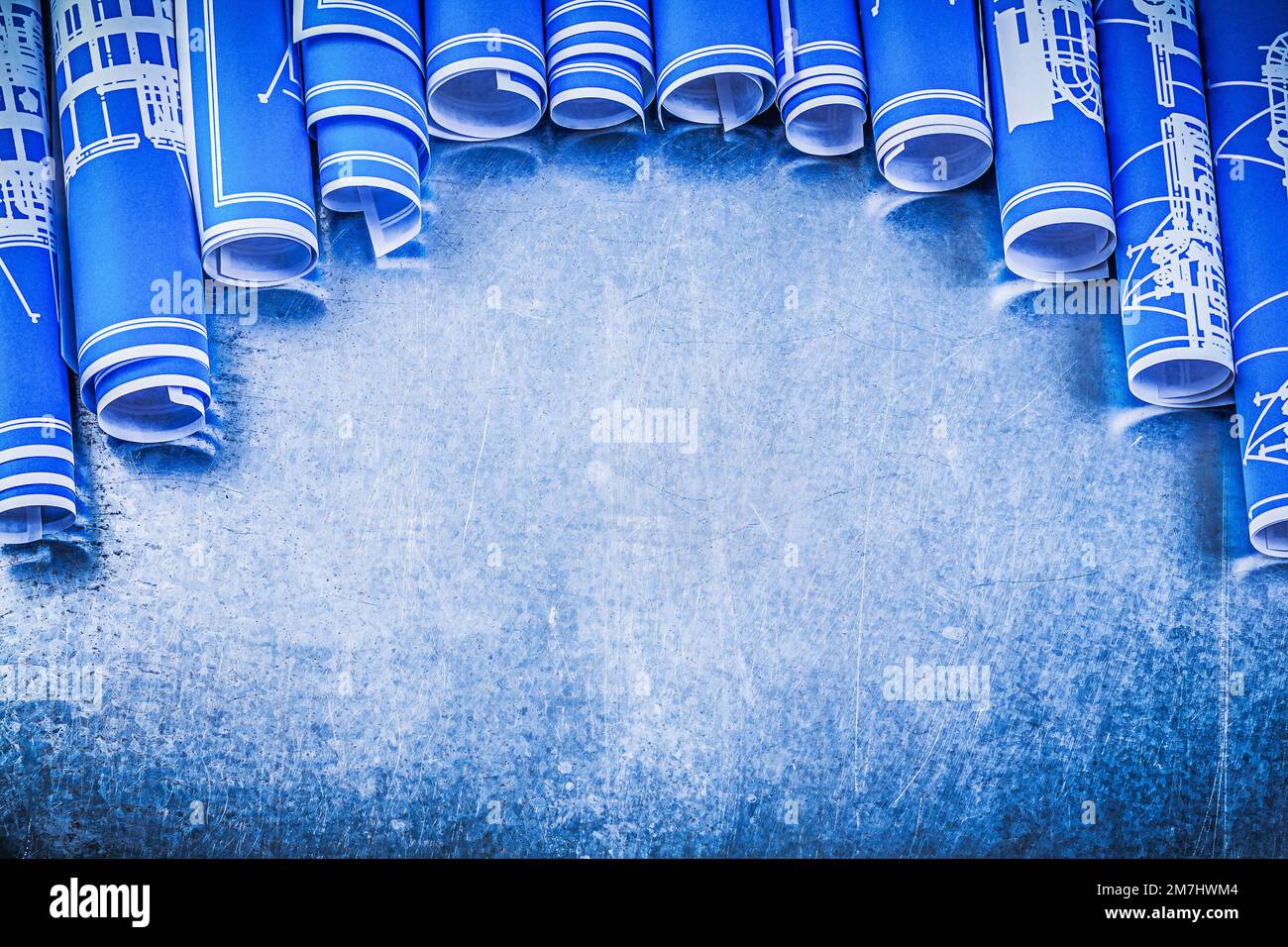 Blue engineering drawings on metallic background construction concept ...