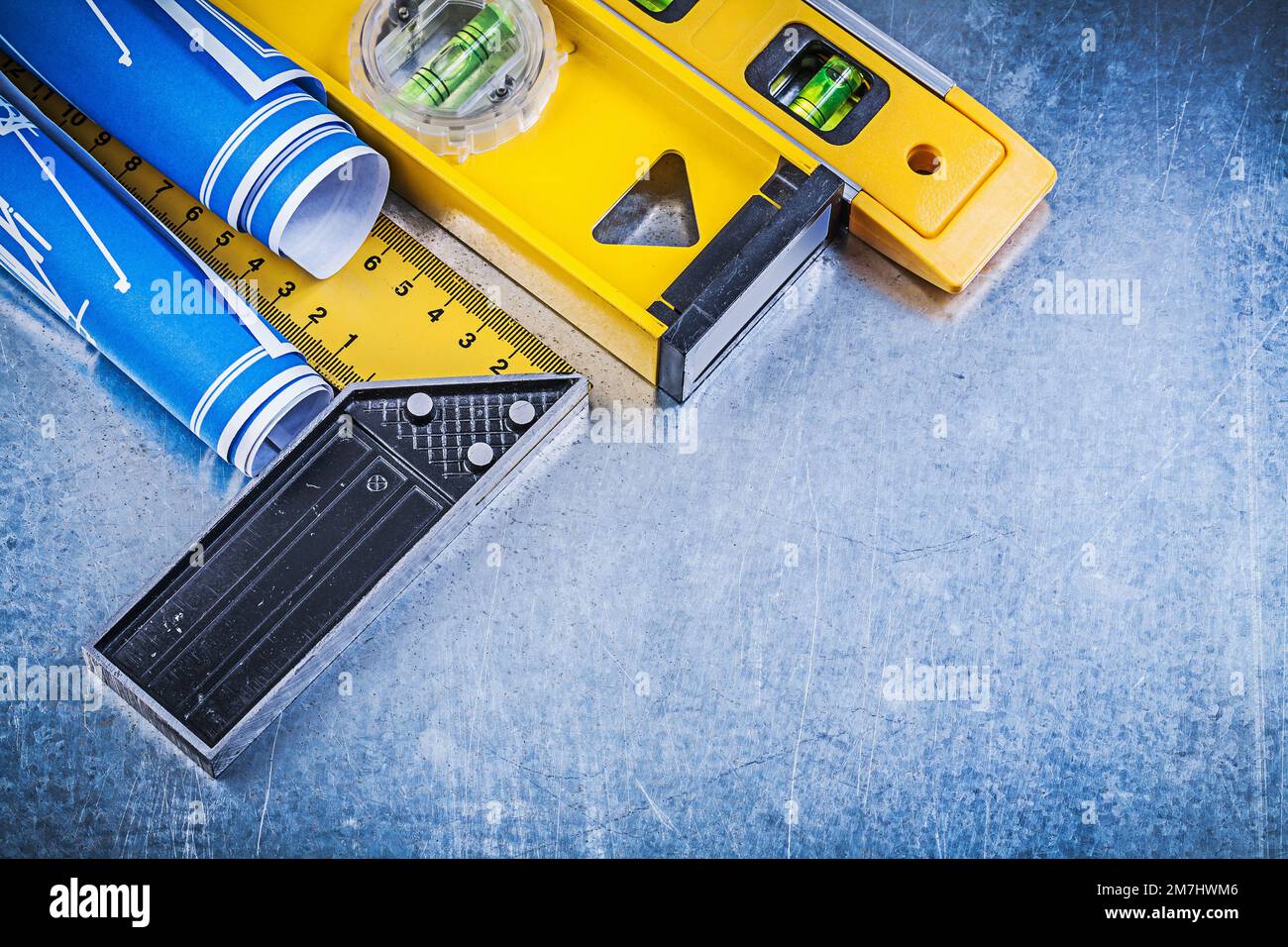 Blue engineering drawings construction levels square ruler on metallic ...