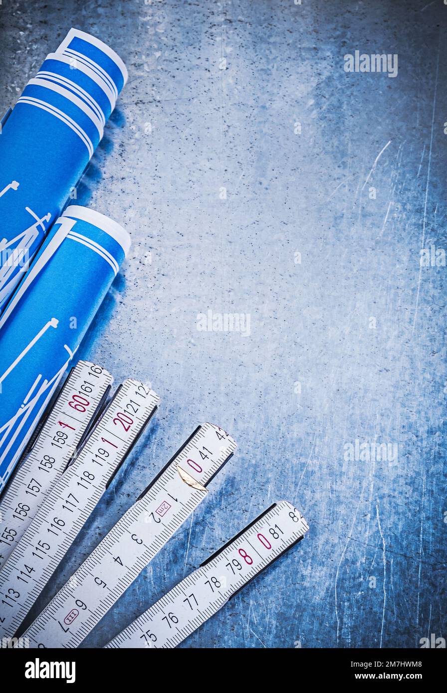Blue engineering drawings wooden meter on metallic background building ...