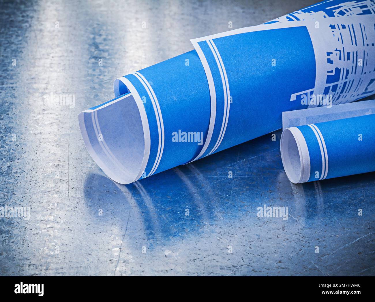 Blue engineering drawings on metallic background construction concept ...