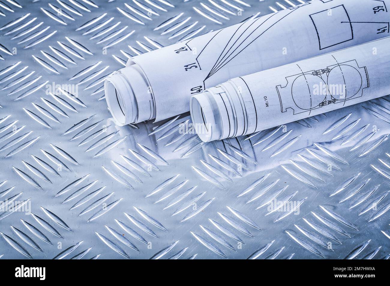 Blueprint rolls on corrugated metal plate construction concept Stock ...