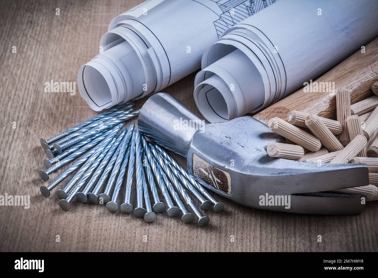 Blueprints claw hammer wooden dowels and metal construction nails Stock ...