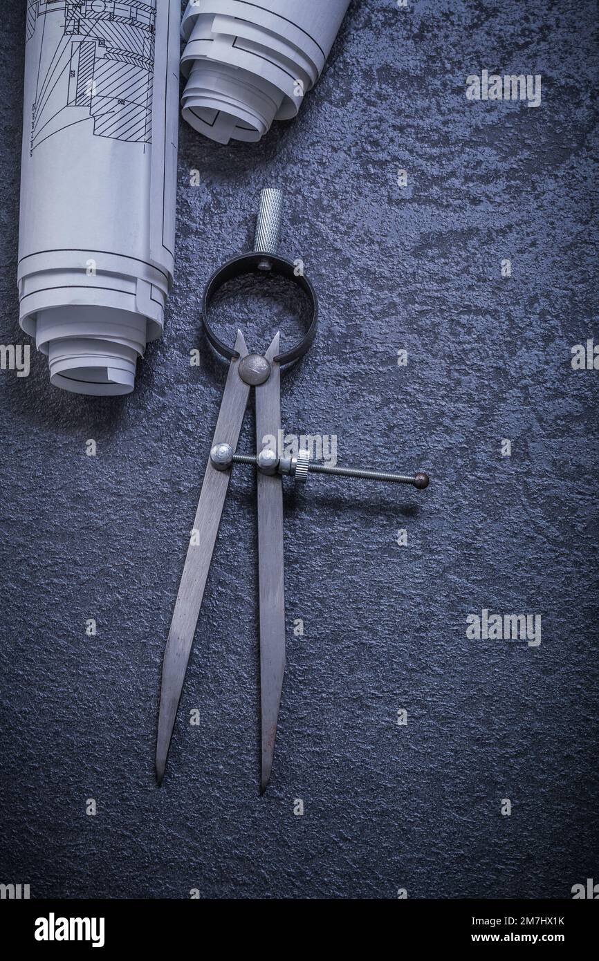 Blueprints drawing compass on black background construction concept ...