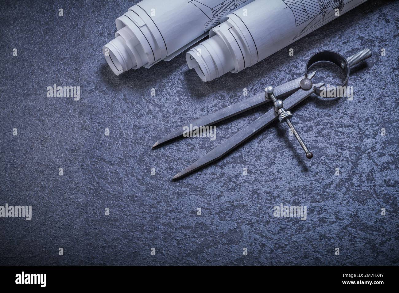 Blueprints pair of compasses on black background construction concept ...