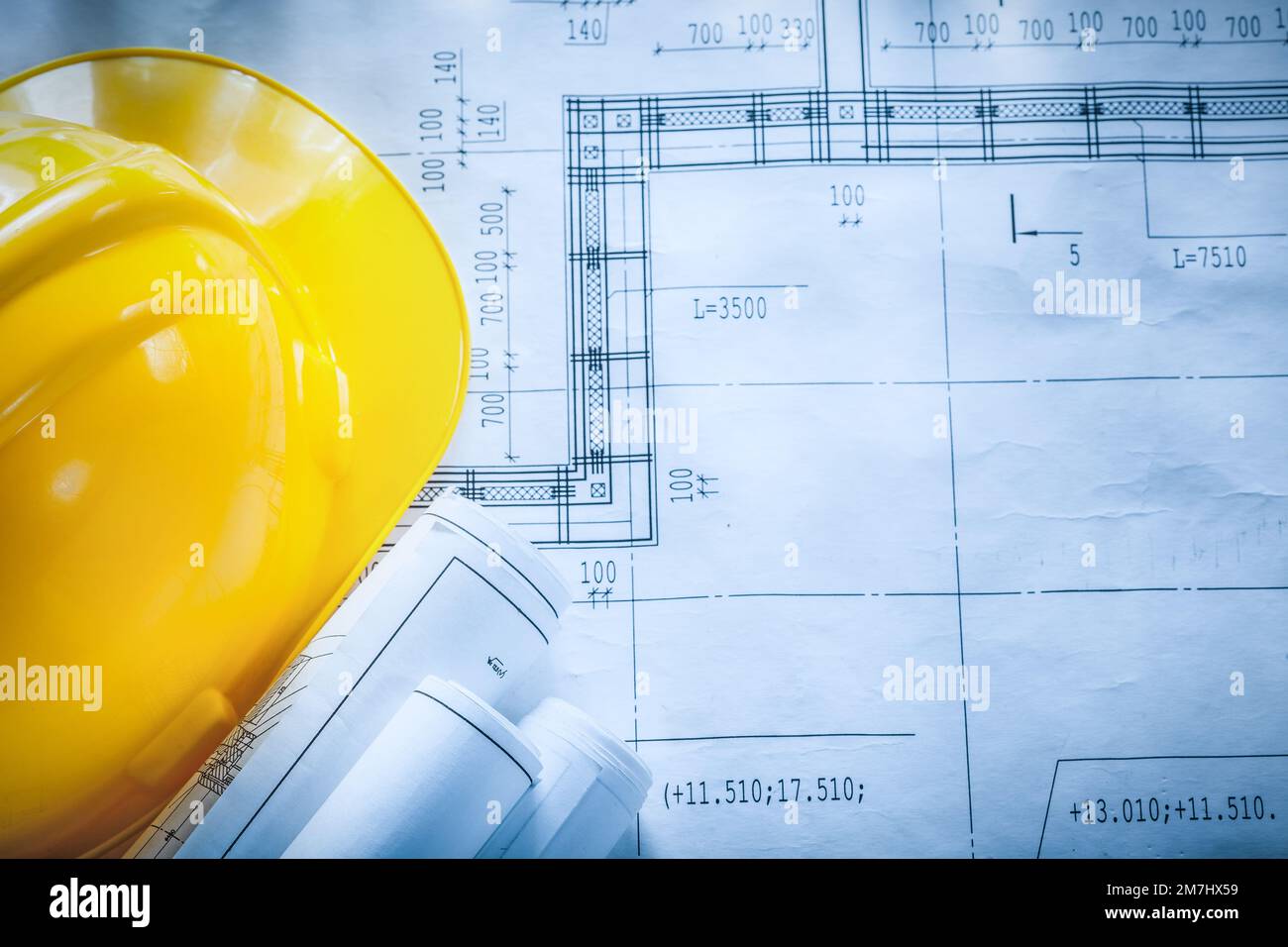 Building helmet construction drawings on blueprint Stock Photo - Alamy