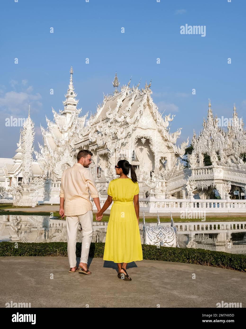 A couple visits the White Temple Chiang Rai Thailand, Wat Rong Khun ...