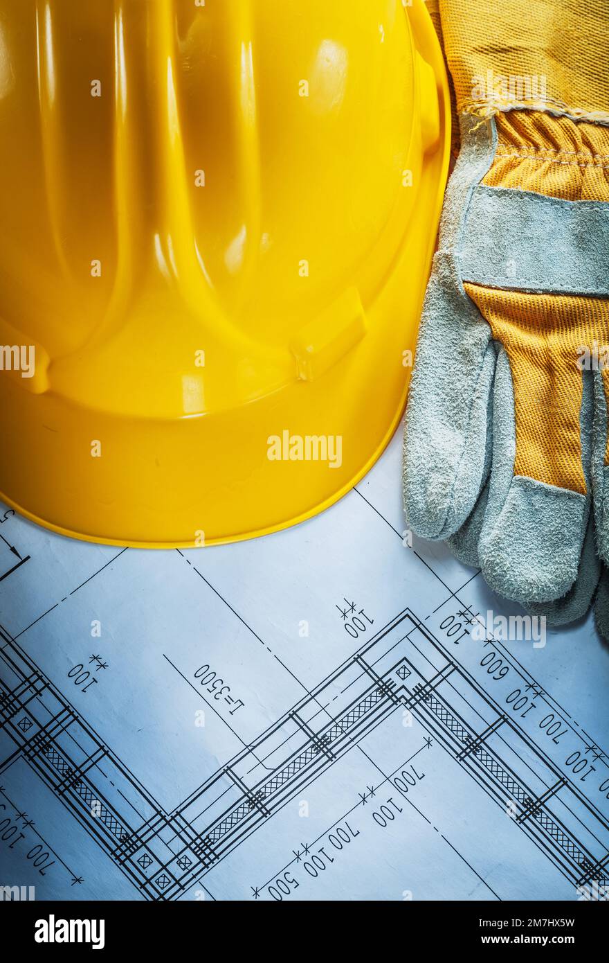 Building helmet safety gloves on construction drawing Stock Photo - Alamy