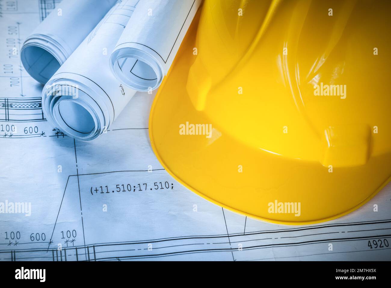 Building helmet construction plans on blueprint Stock Photo - Alamy