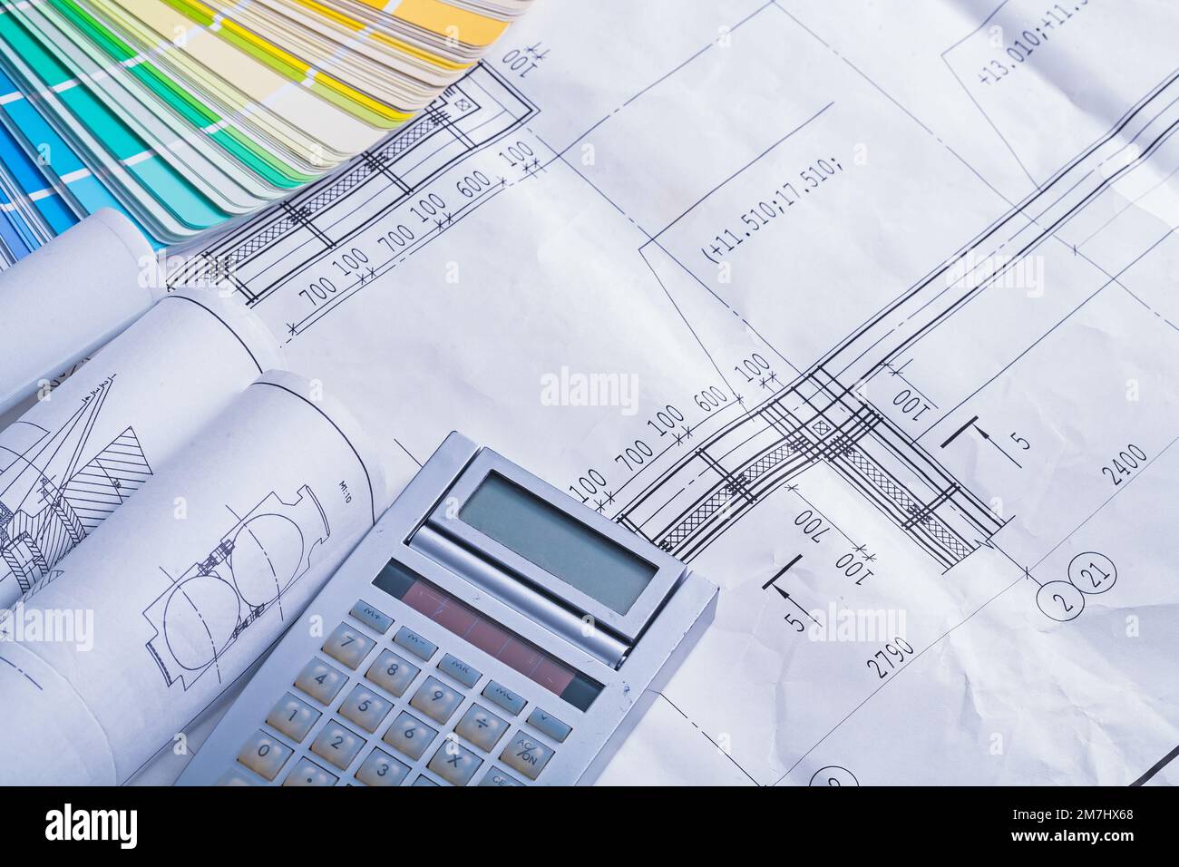 calculator rolled blueprints color palette Stock Photo - Alamy