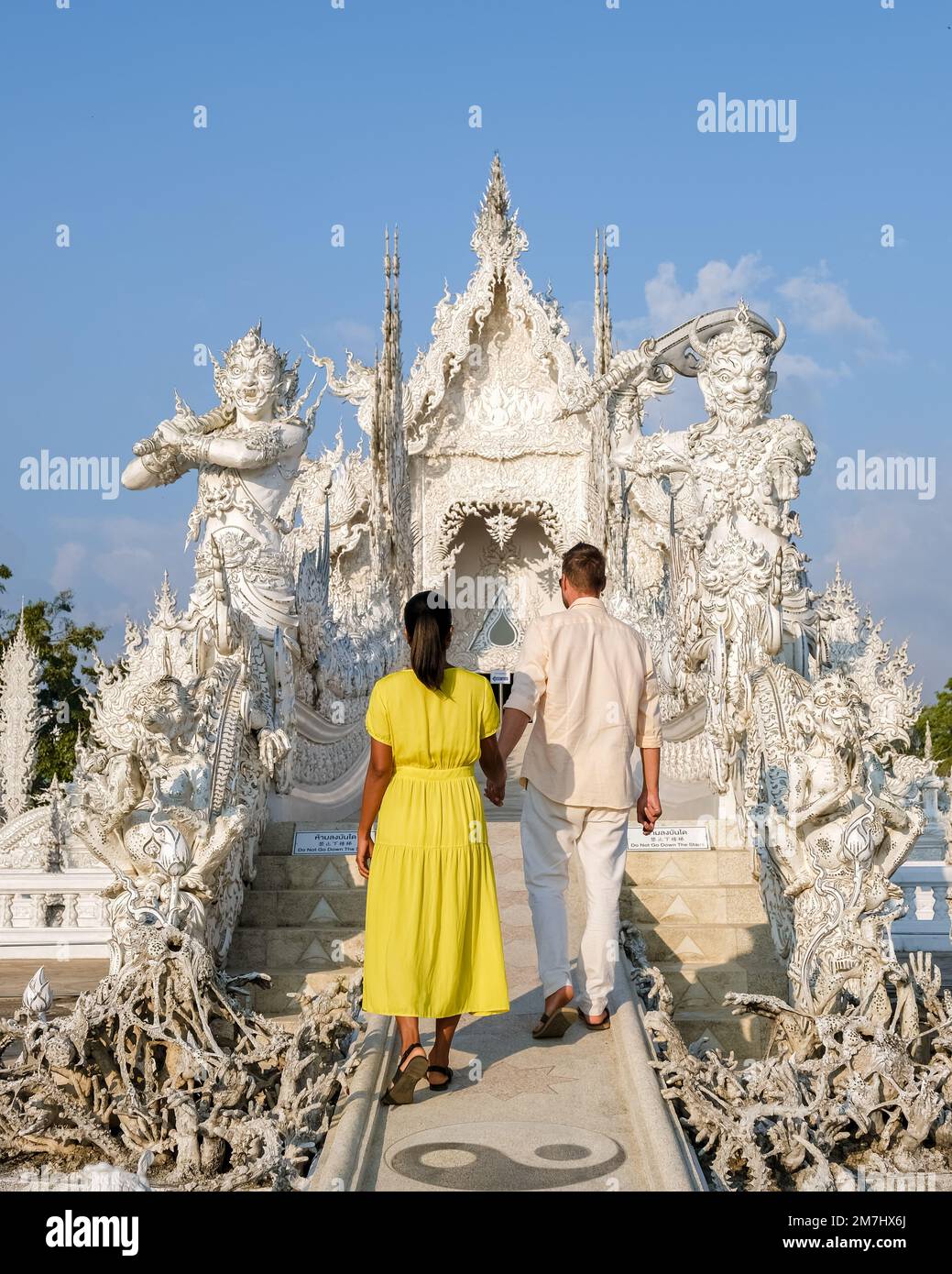 A couple visits the White Temple Chiang Rai Thailand, Wat Rong Khun ...