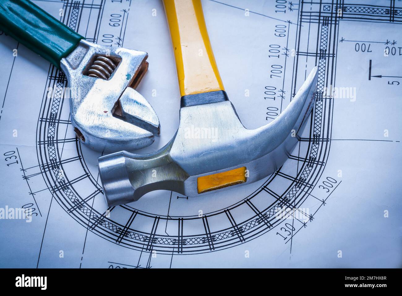 Claw hammer adjustable spanner on blueprint building and architecture ...