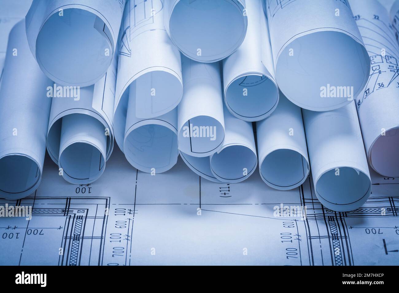 Collection of blueprint rolls construction concept Stock Photo - Alamy