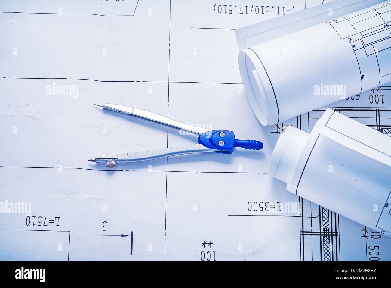 compass and two rolled up white blueprints horizontal version Stock ...