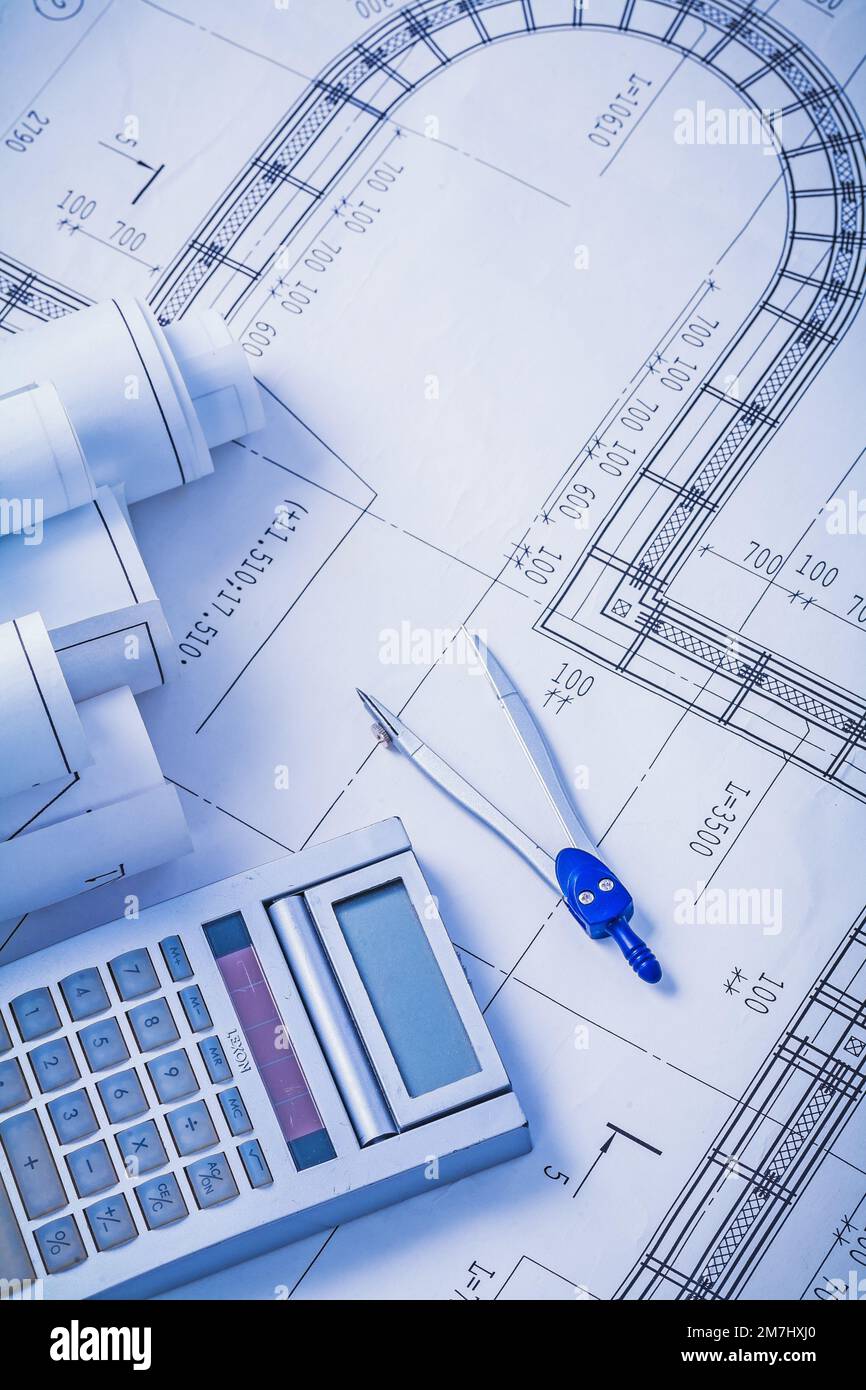 compass calculator white rolled up bluprints Stock Photo - Alamy