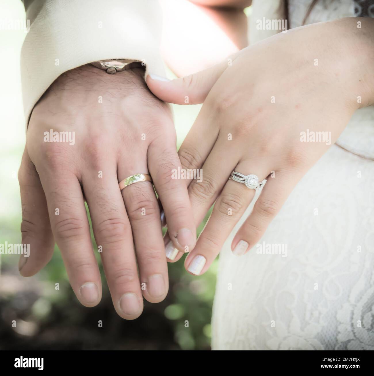Two hands with rings. Both a new married couple Stock Photo - Alamy